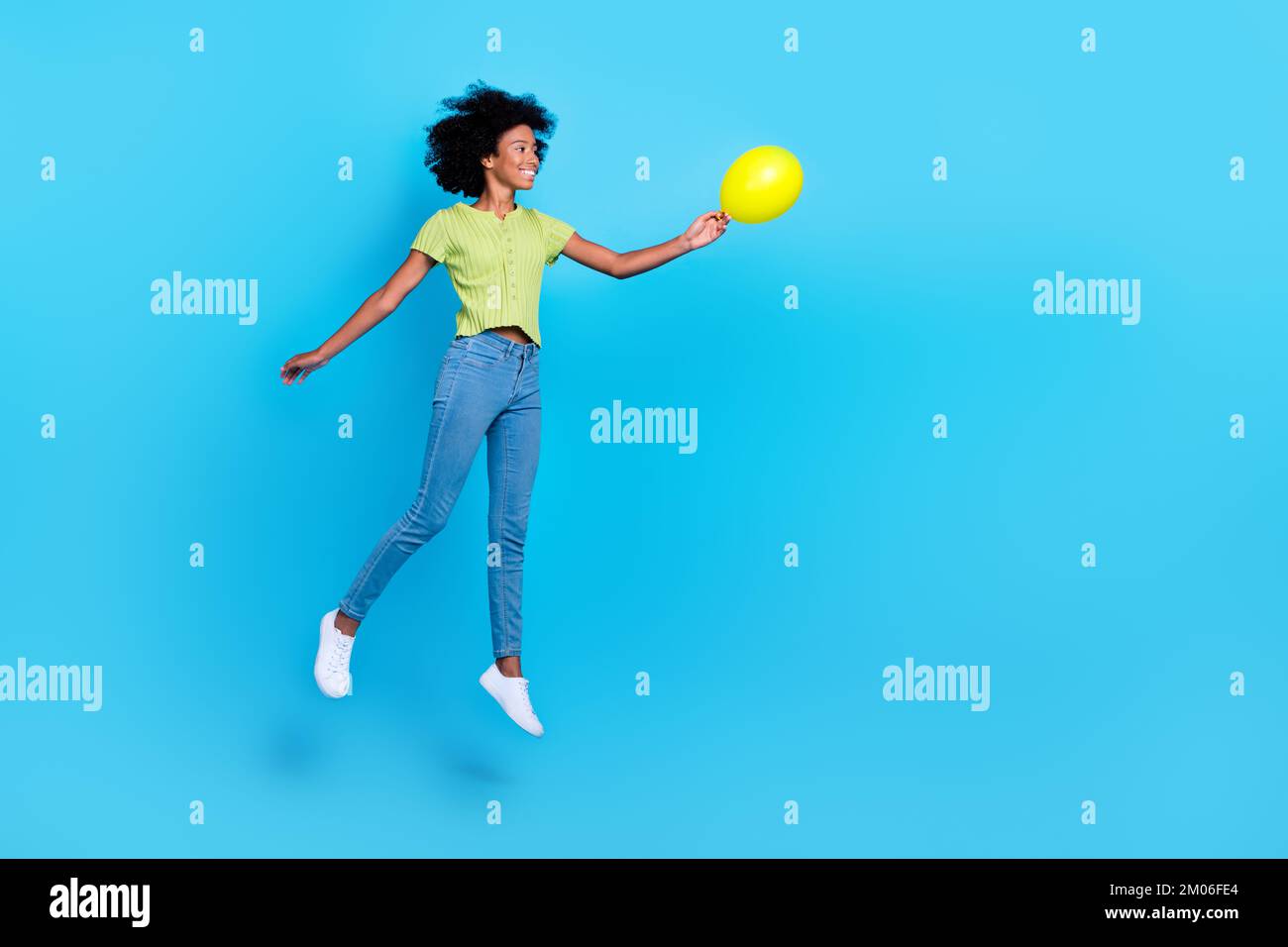 Full body length photo of excited positive dreaming teenager lady hold ...