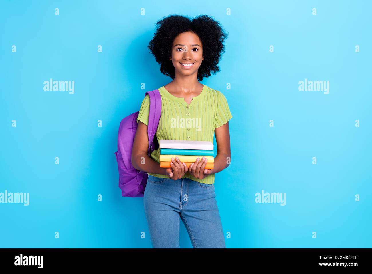 Photo of smart clever positive girl with perming coiffure dressed green ...
