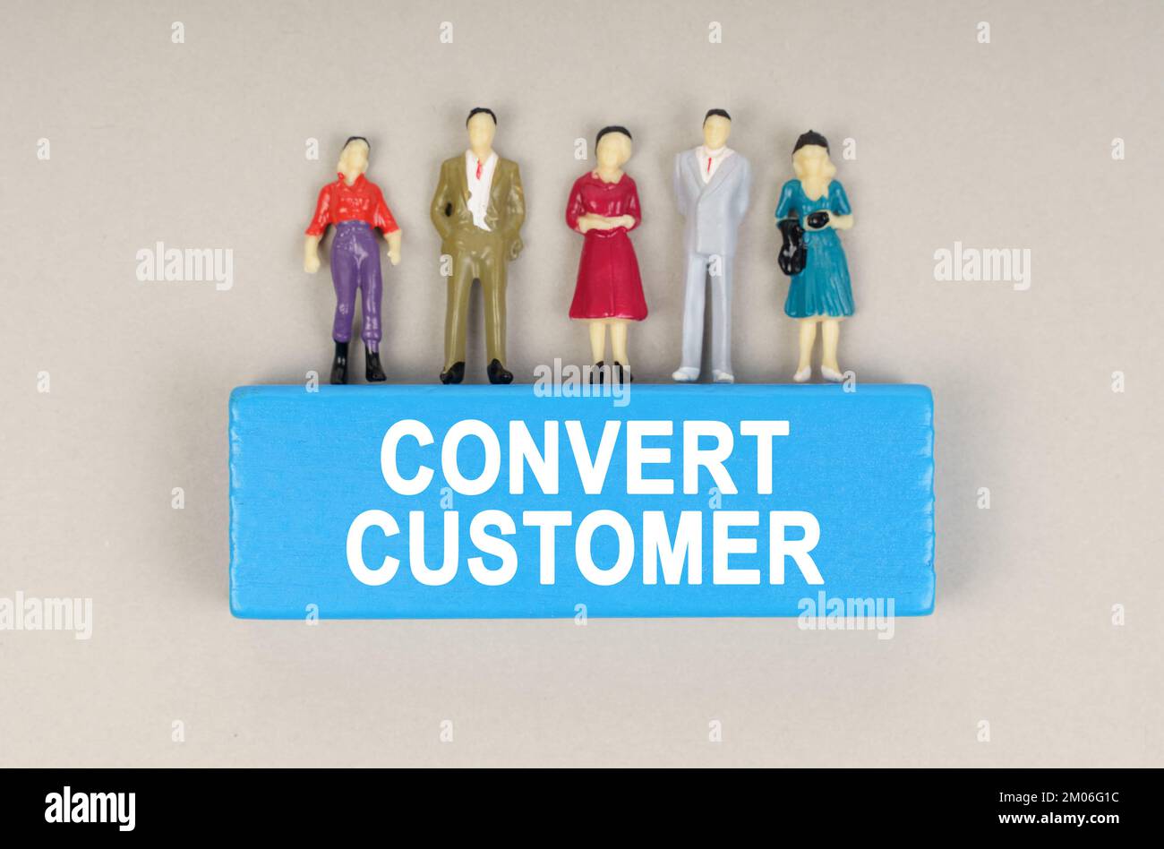 Business concept. On the blue block the inscription - Convert Customer ...