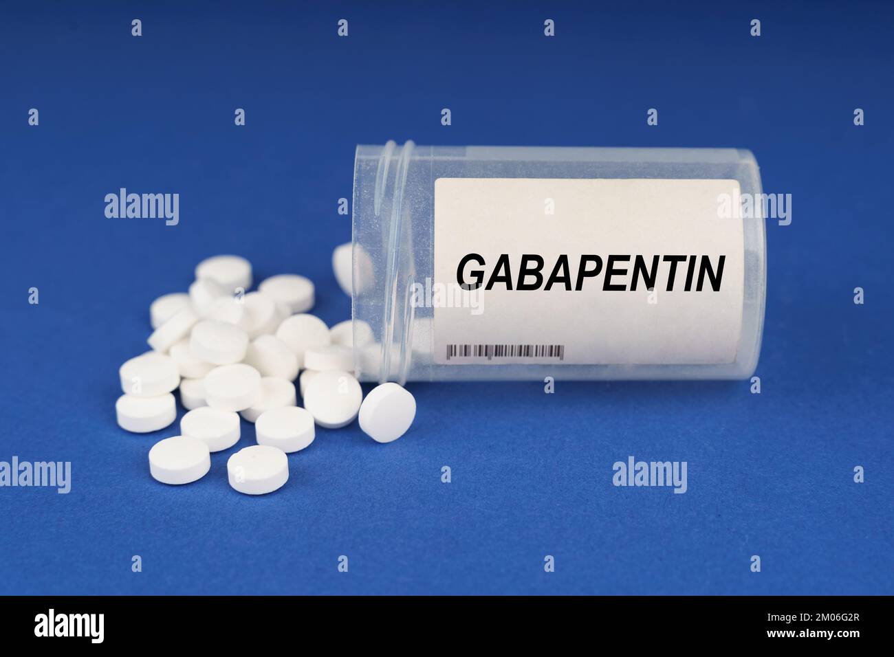 The concept of pharmacology and health. On a blue surface are pills and ...