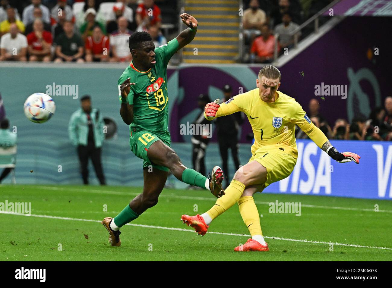 Ismaila Sarr of Senegal and Jordan Pickford of England during England v ...