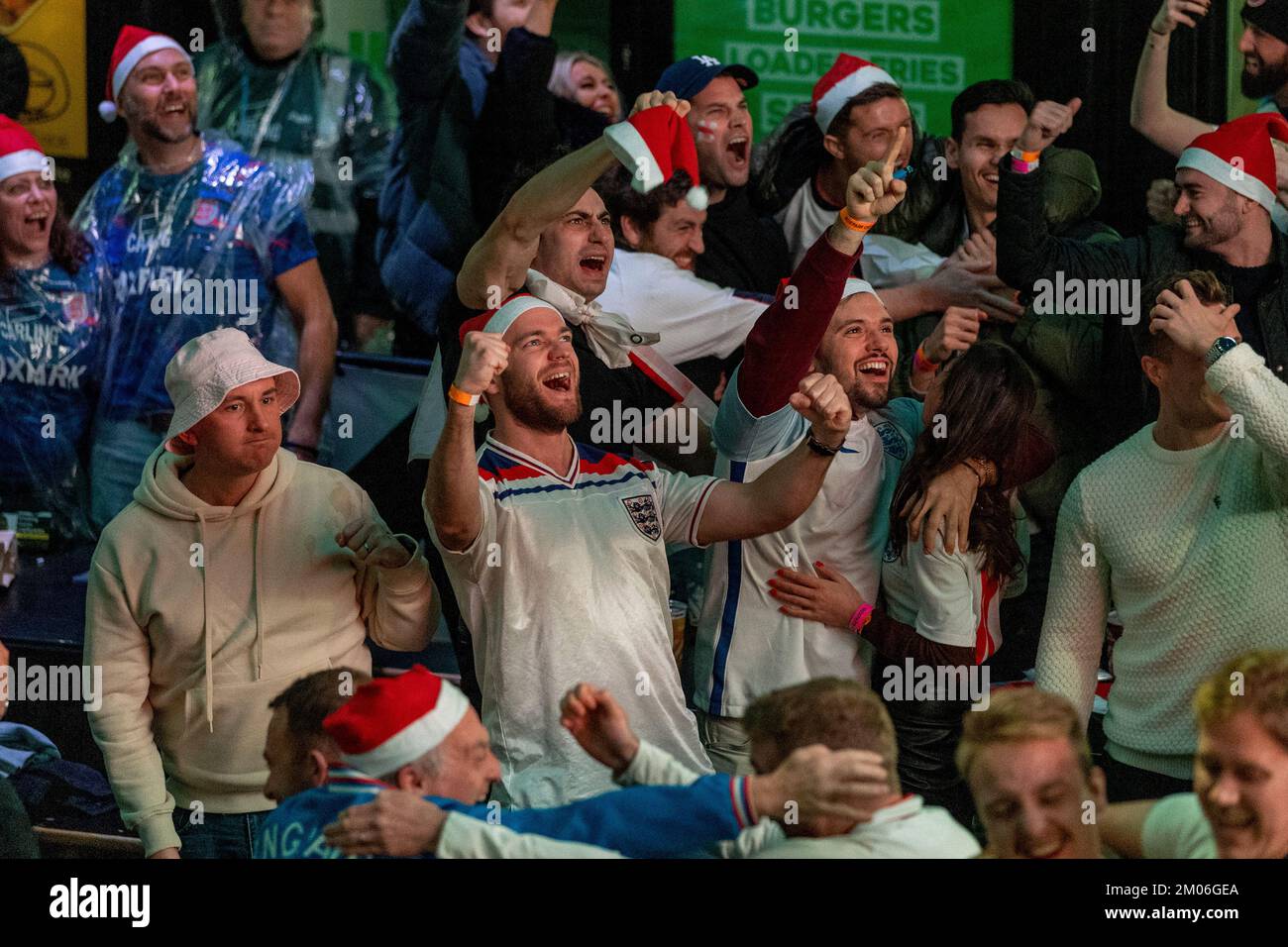 England fans celebrate their second goal at BOXPARK Croydon in London ...