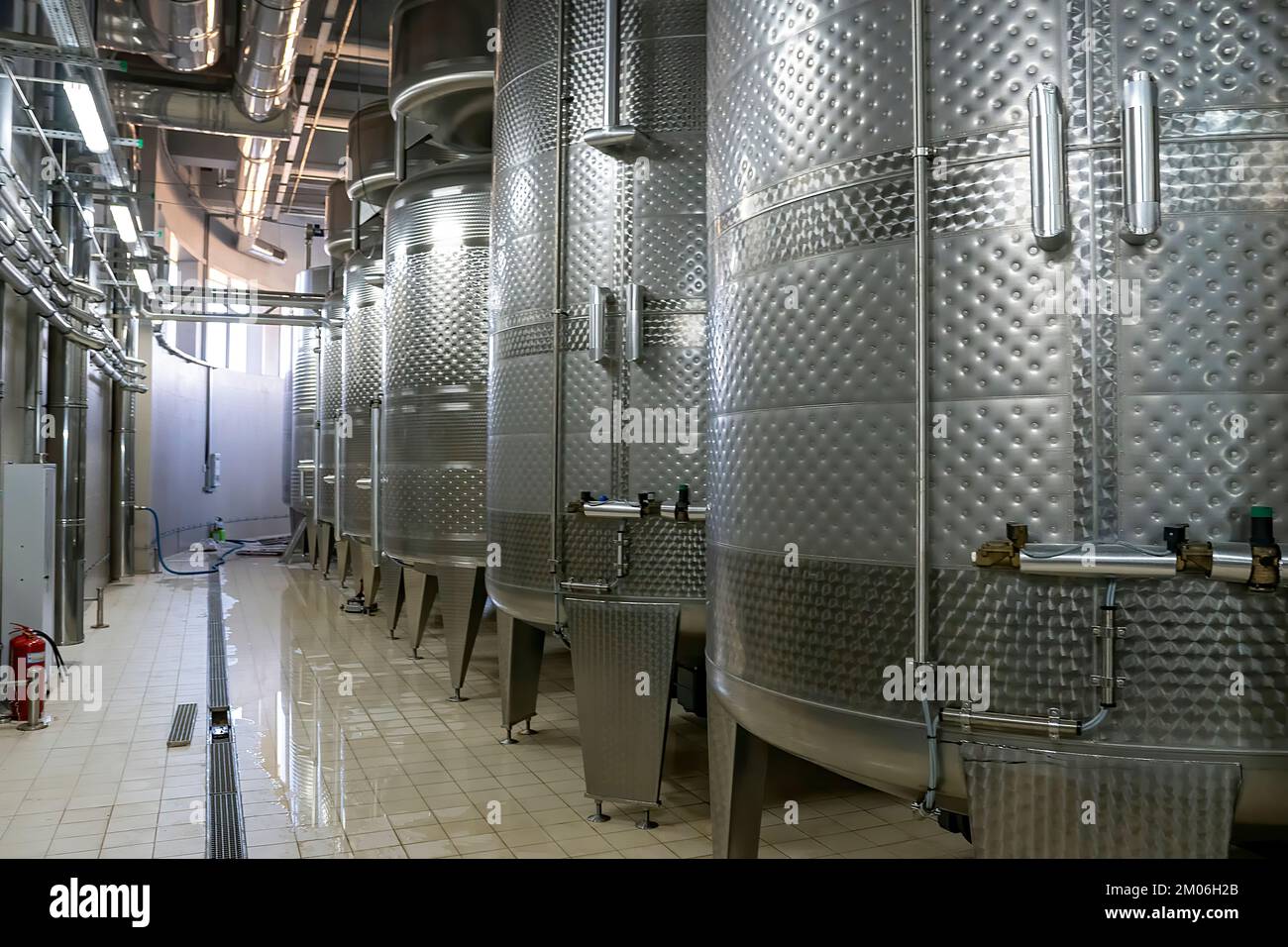 Large modern wine barrels at the winery, the concept of a large factory ...