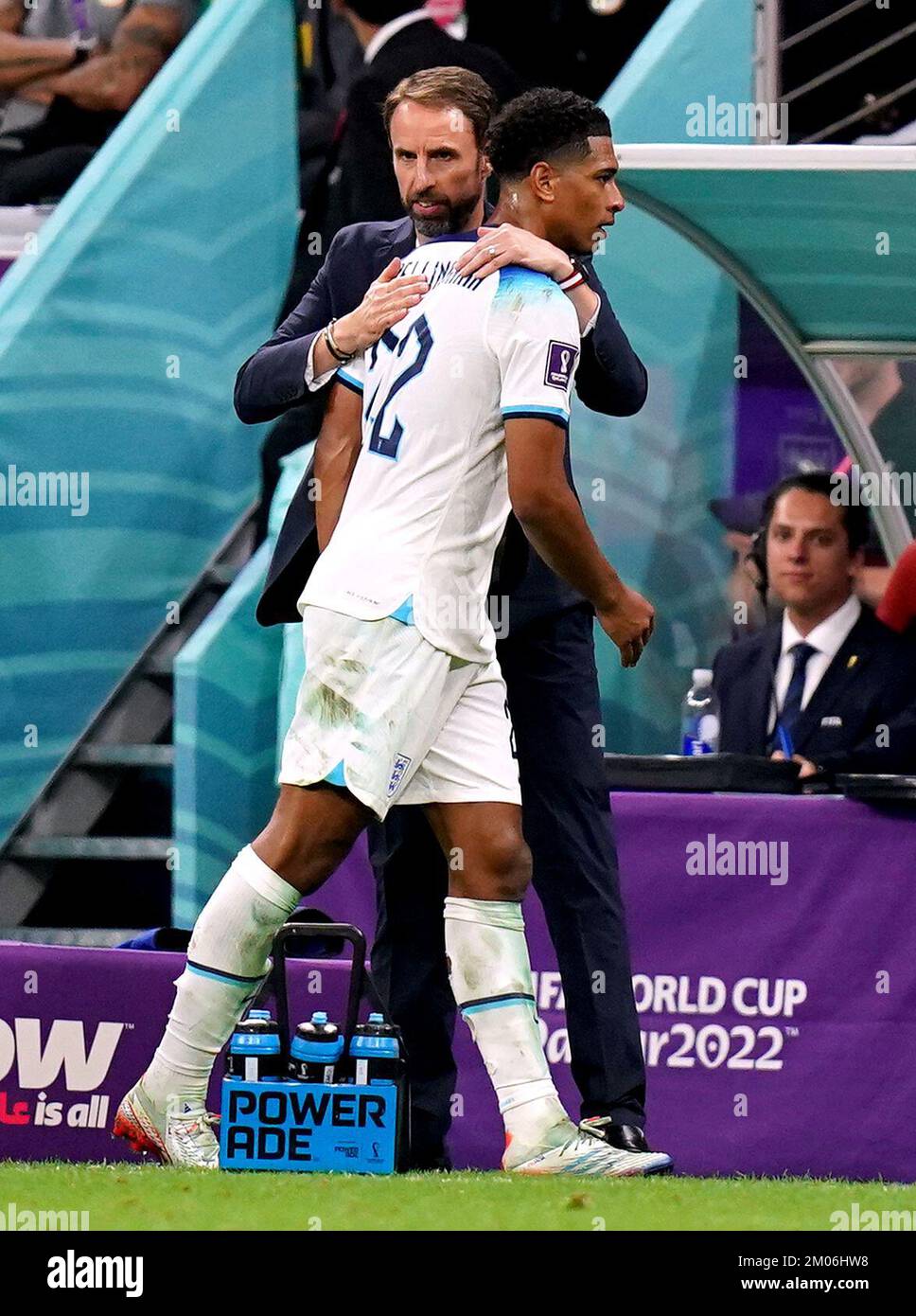 England's Jude Bellingham is substituted as he is given a hug by ...
