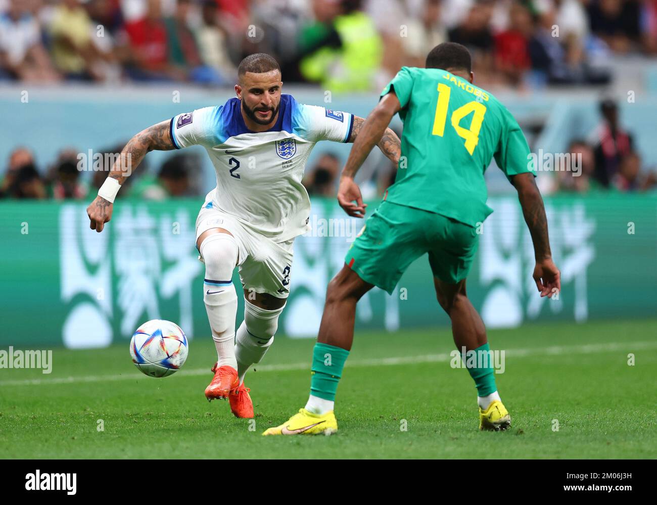 Al Khor, Qatar. 4th Dec, 2022. Kyle Walker of England faces Ismail ...