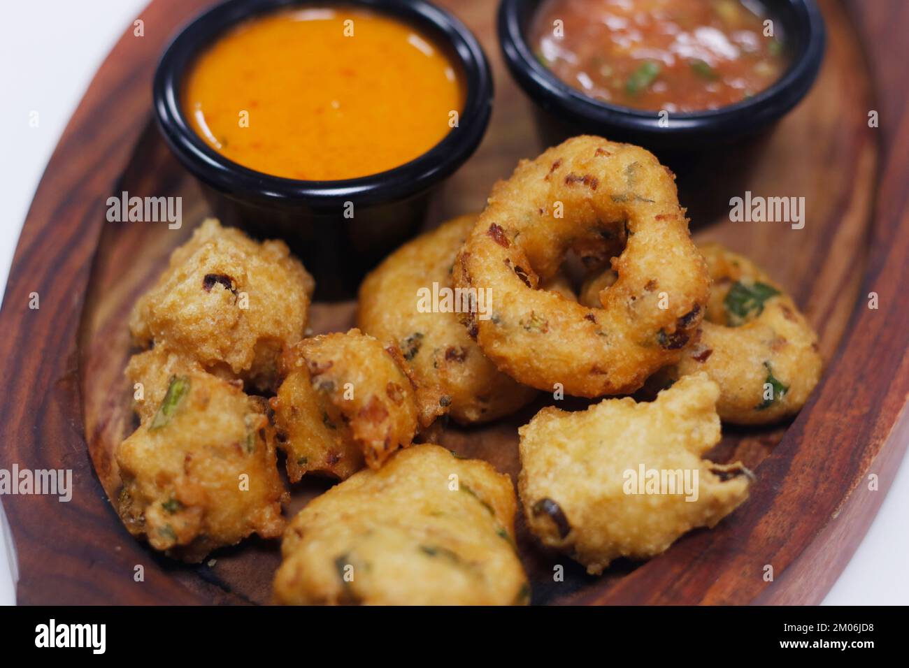 traditional indian snack food, crispy deep fried vada and chutneys in a ...