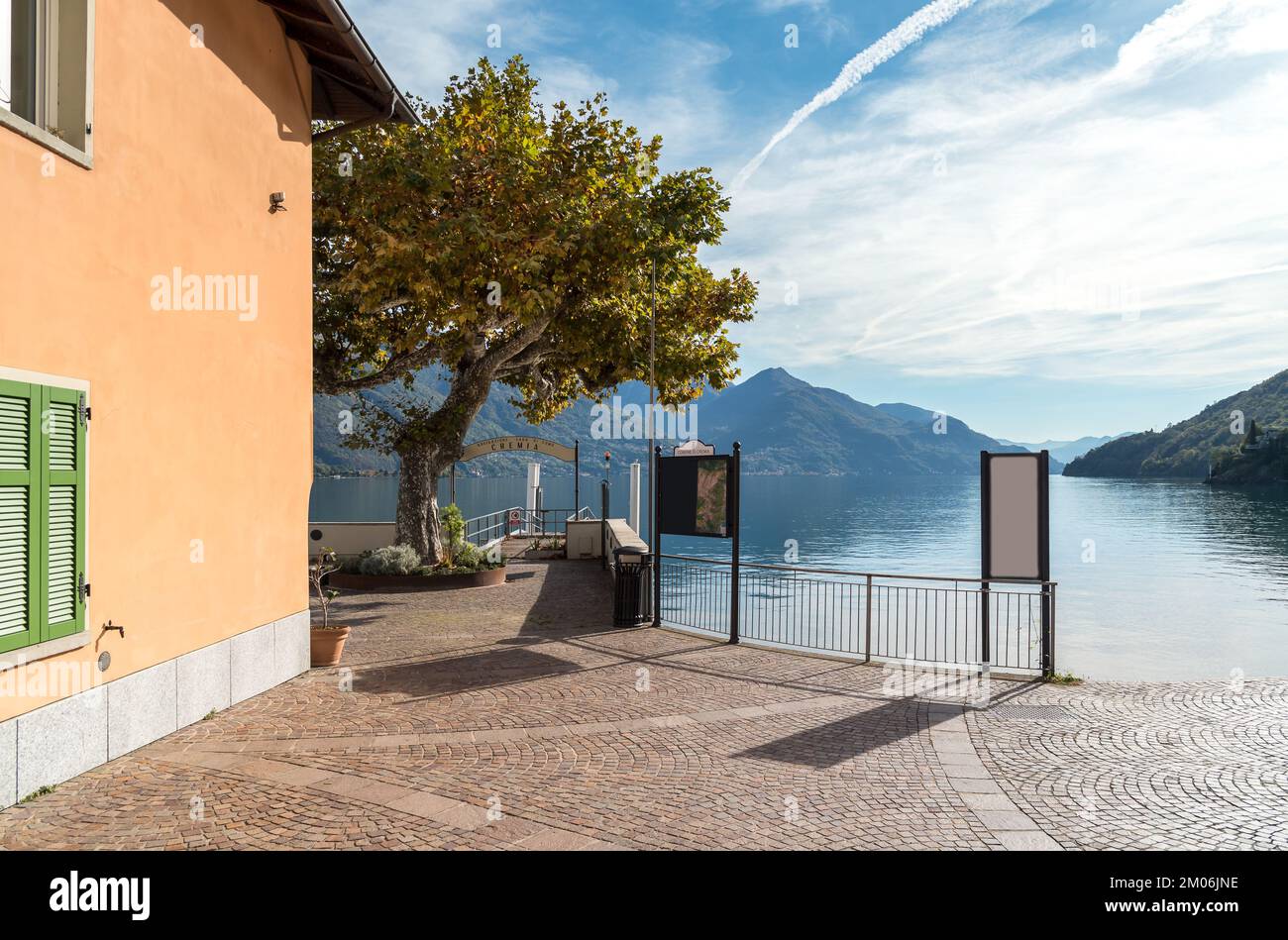 Pier of Cremia village situated on the shore of Lake Como, at autumn ...