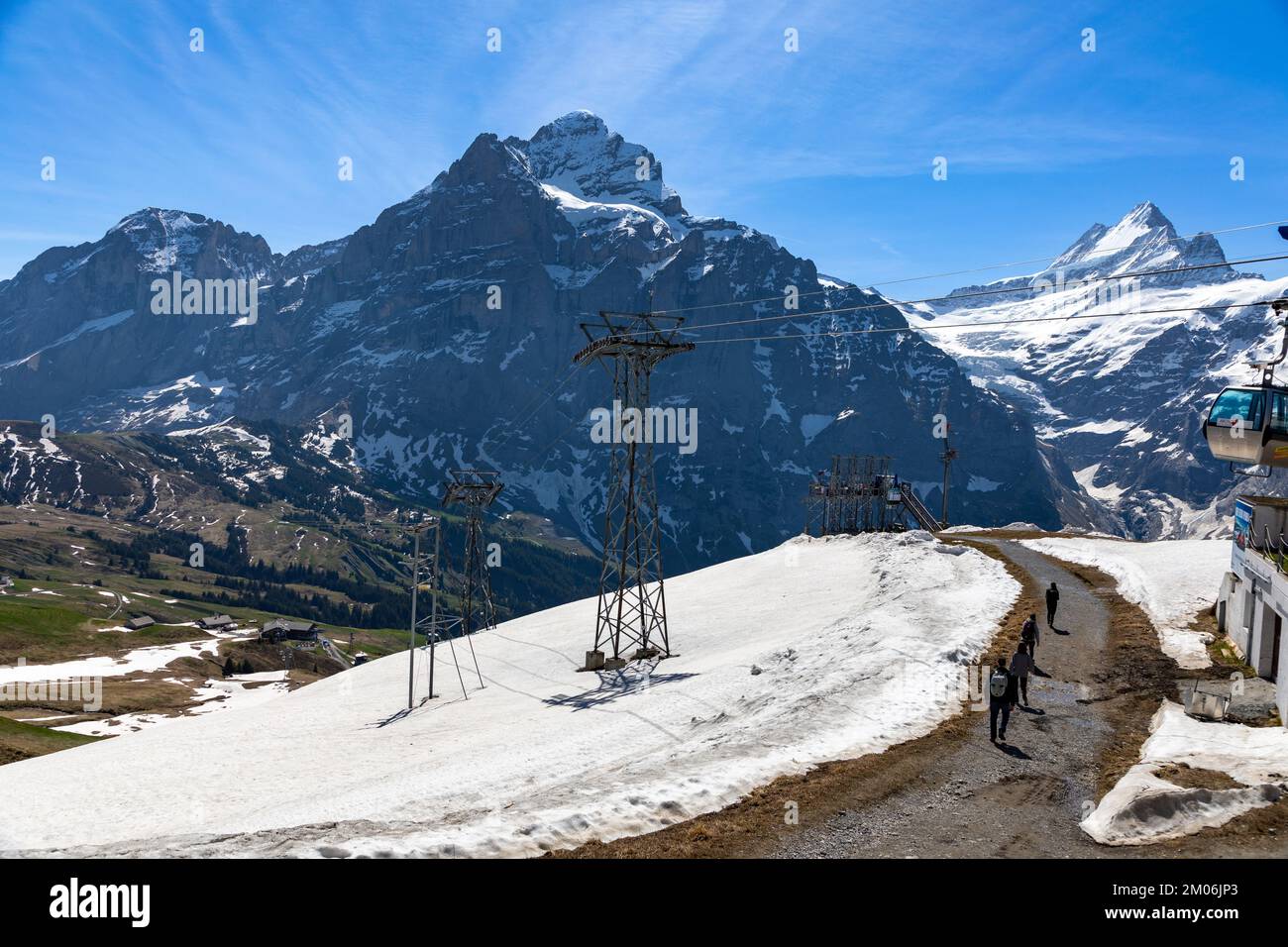 Winter snow melting around cable car masts during spring at ...