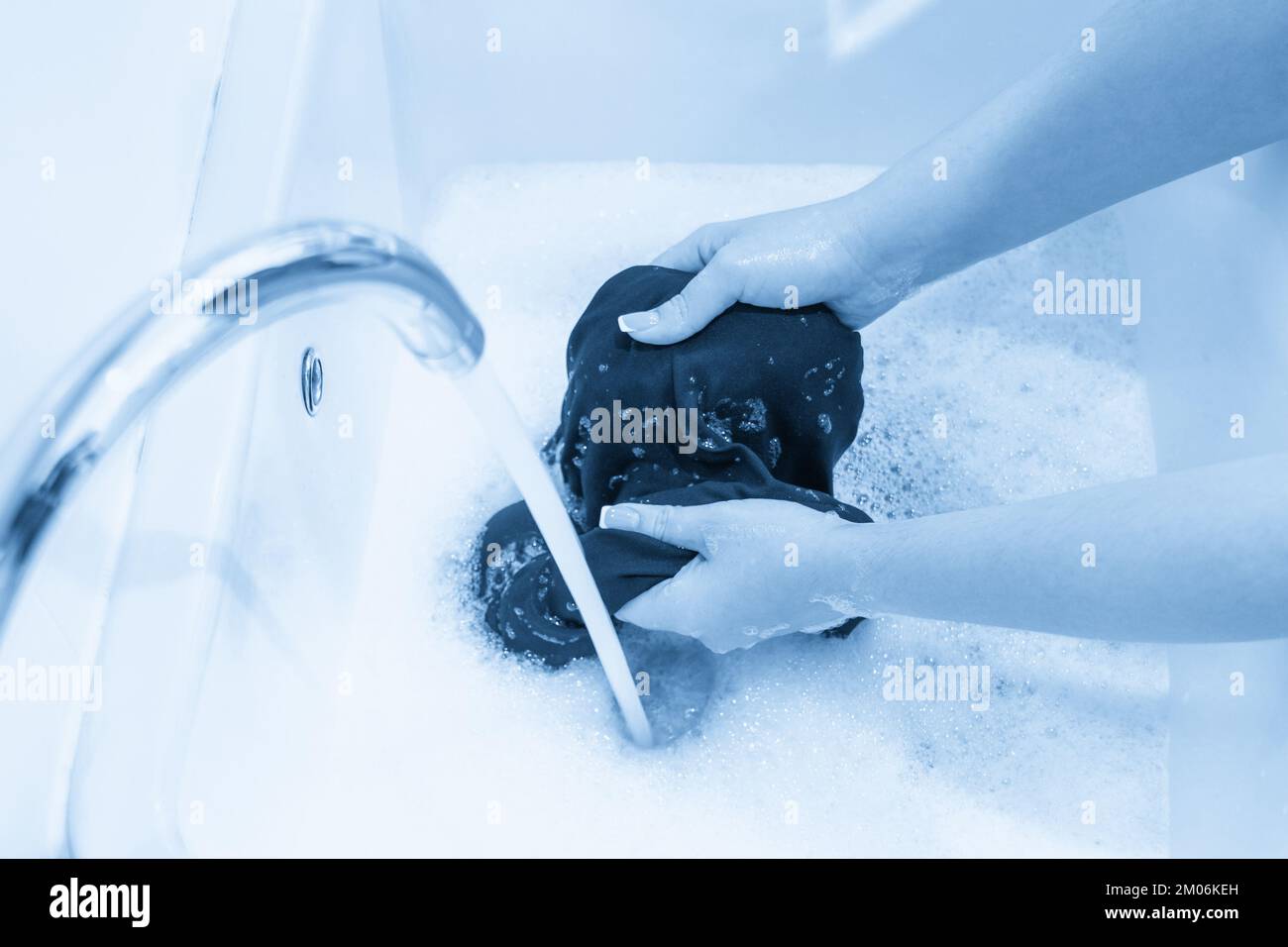 Clothes in basin hi-res stock photography and images - Alamy