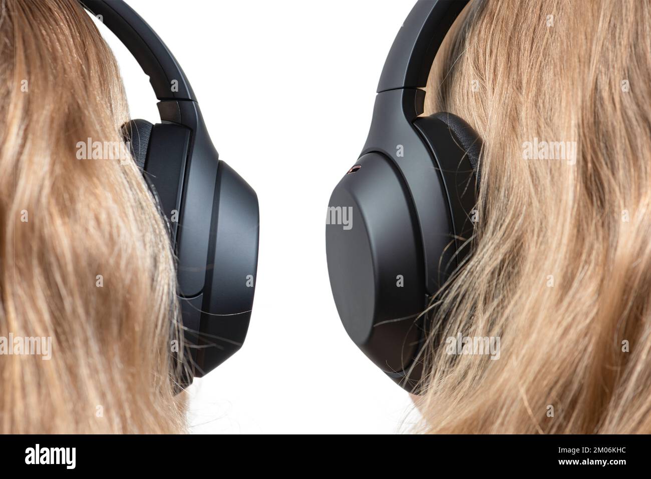Woman in headphones isolated on white. Black headphones on a woman's ...