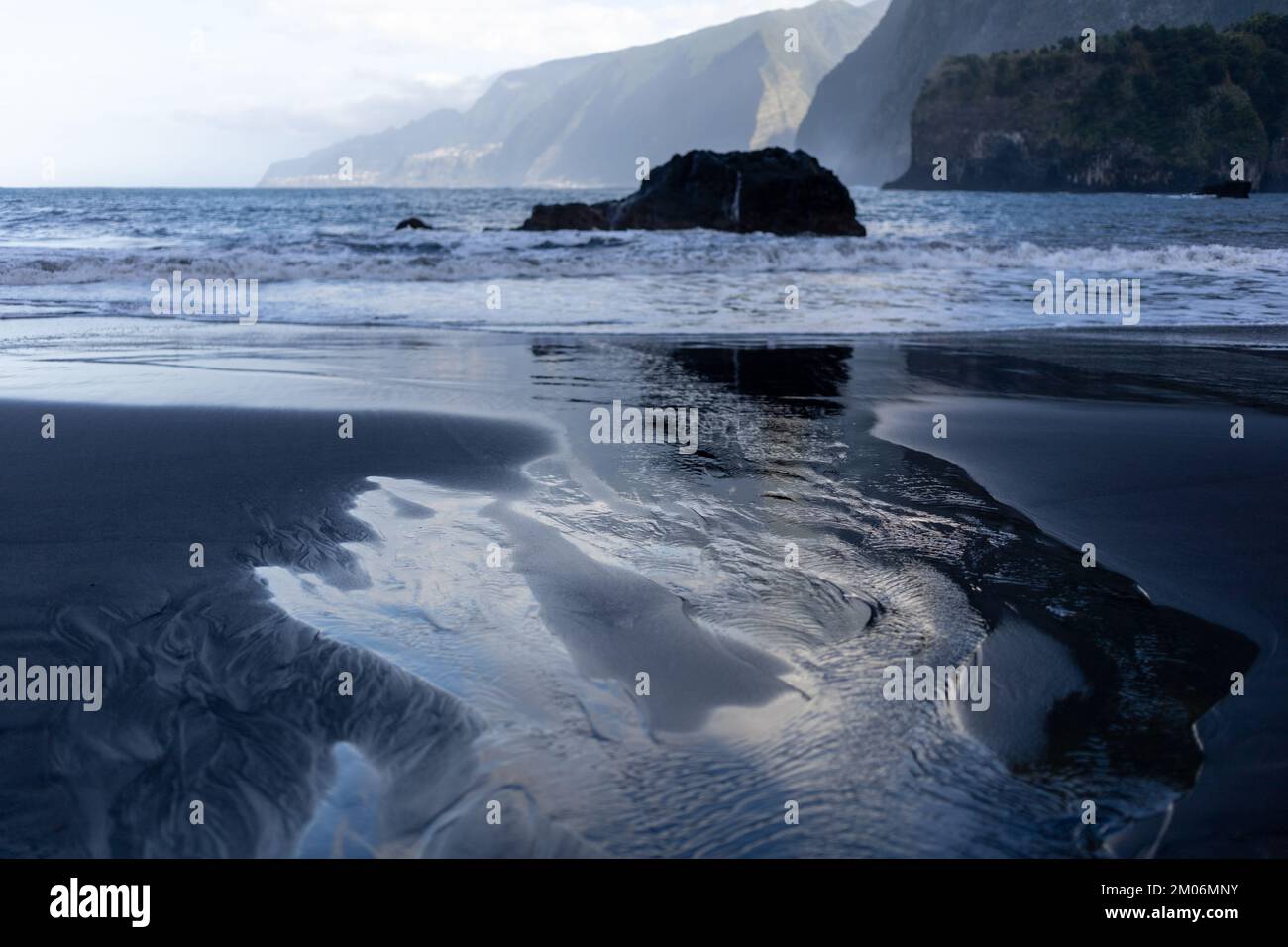 black sand beach of Madeira view on mountains Stock Photo - Alamy