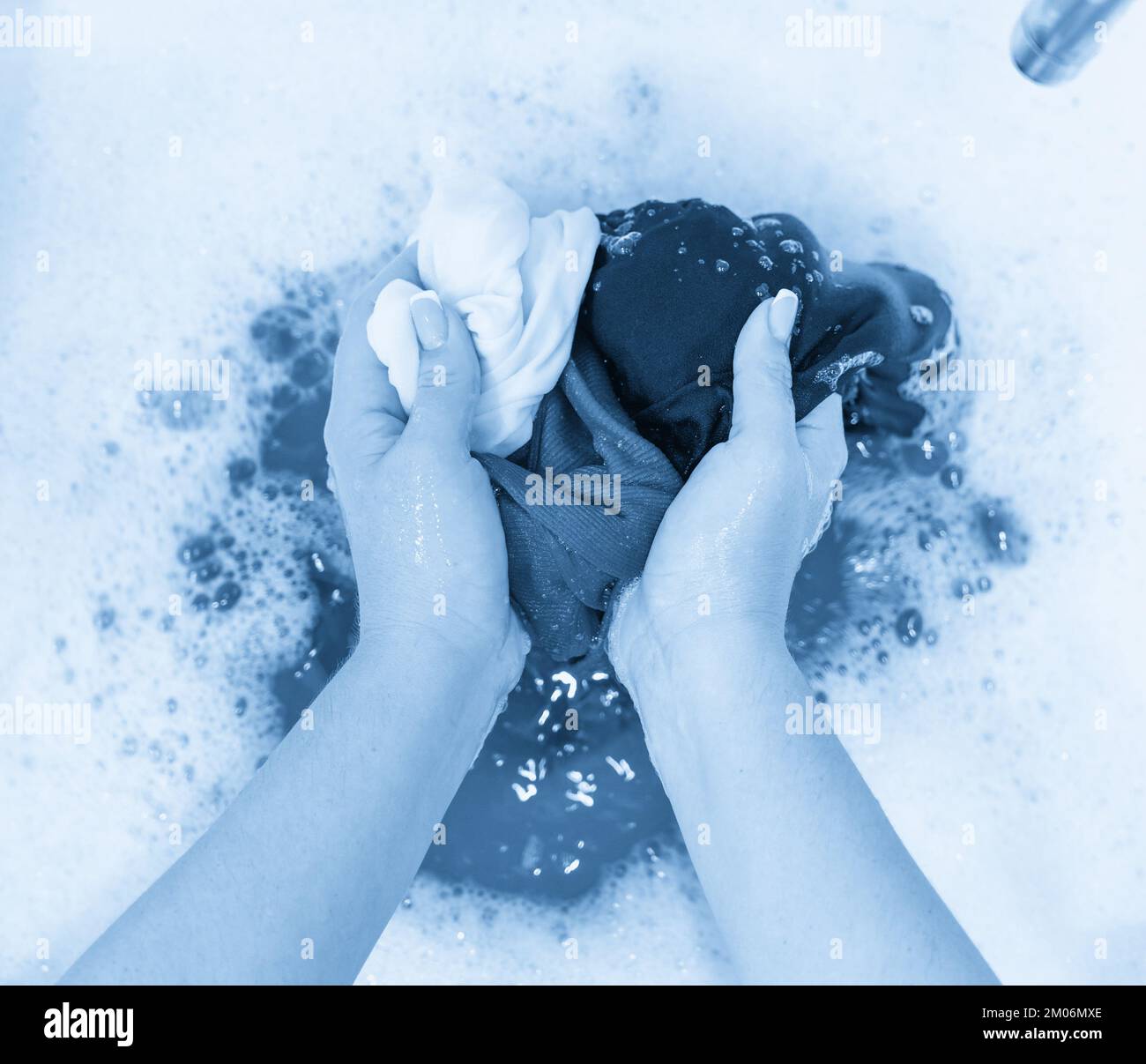 Clothes in basin hi-res stock photography and images - Alamy