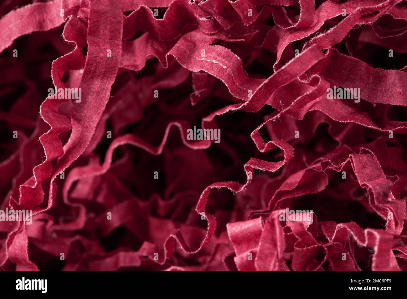 Red chaotic twisted tissue paper tapes. Futuristic abstract background ...