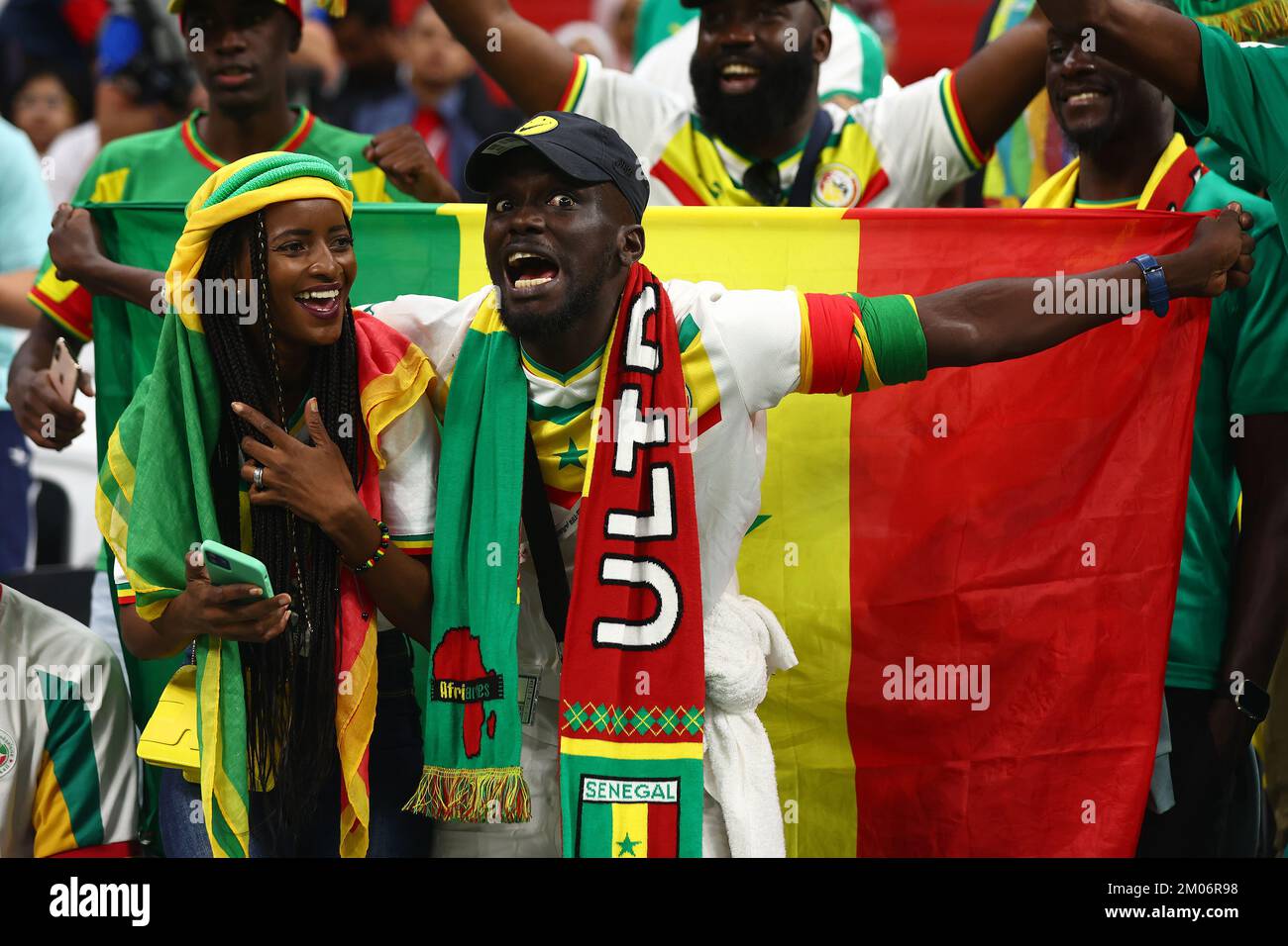 Al Khor, Qatar. 04th Dec, 2022. Senegal fans support their team during ...