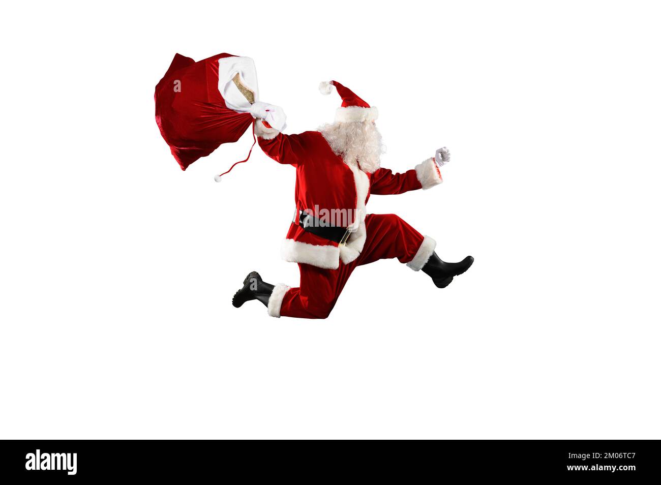 santa claus runs fast to deliver all gifts for christmas Stock Photo - Alamy