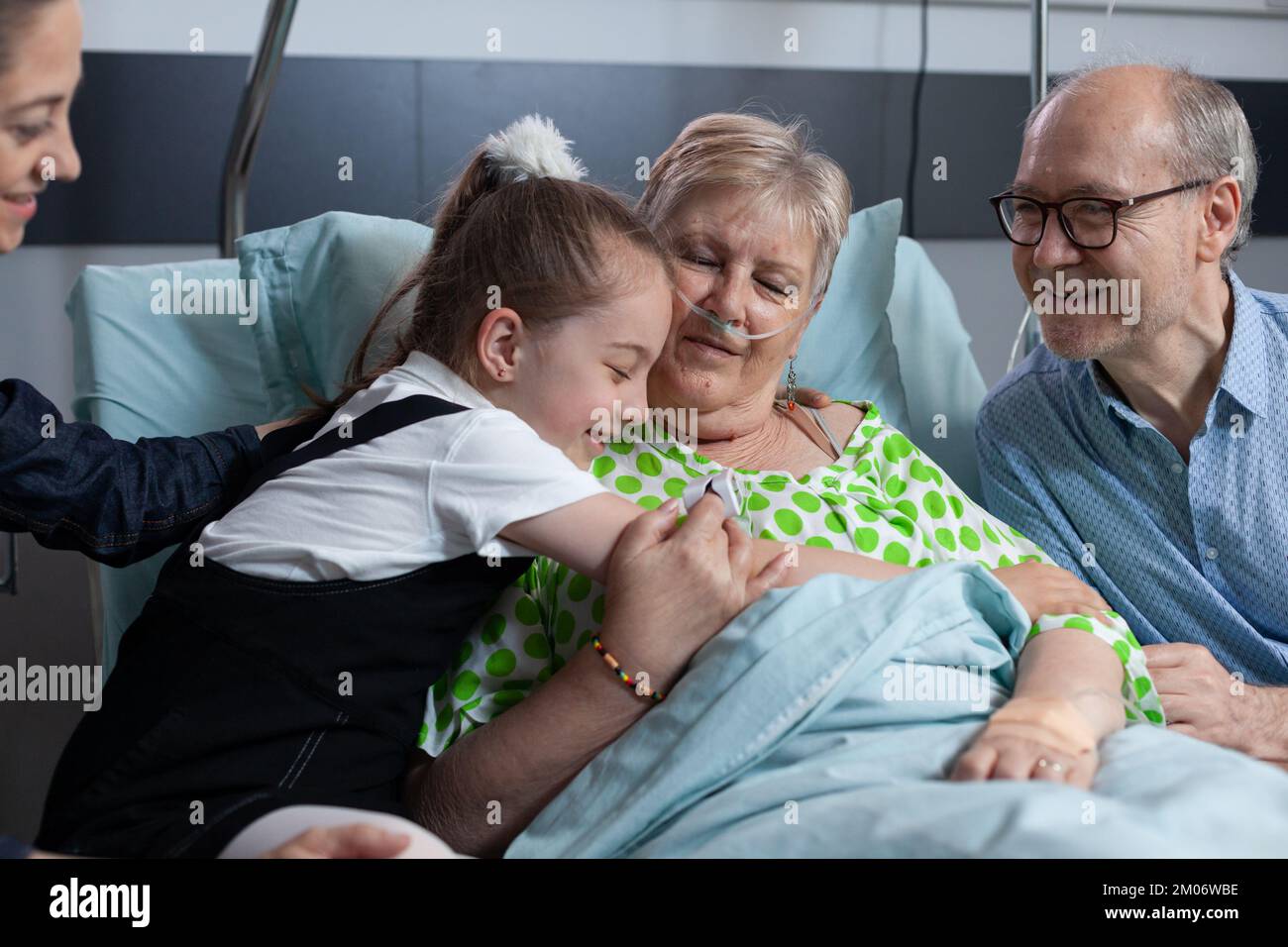 Relatives bidding farewell to elderly woman suffering respiratory tract ...