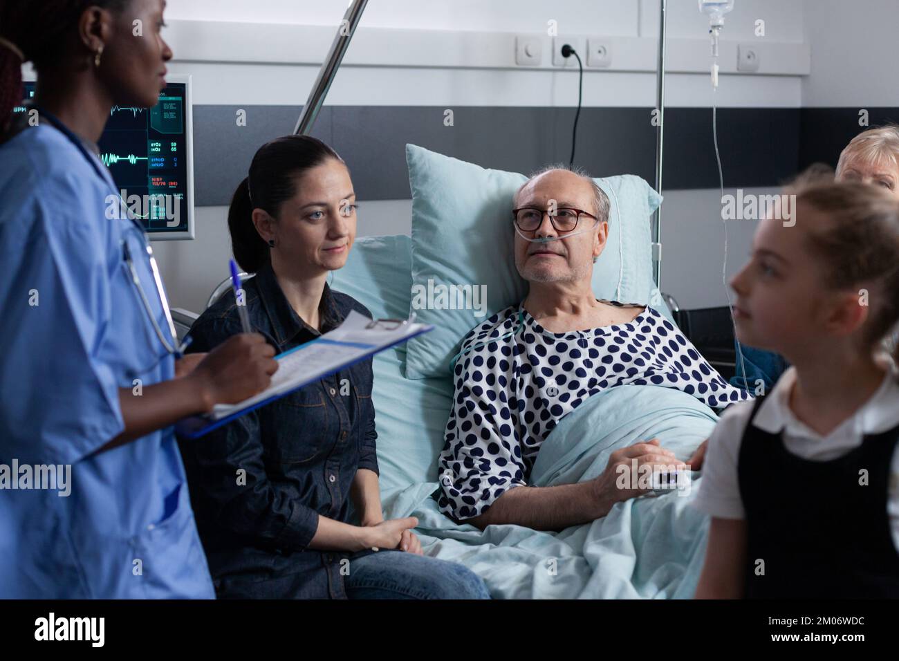 African american female physician filling out medical interventions ...