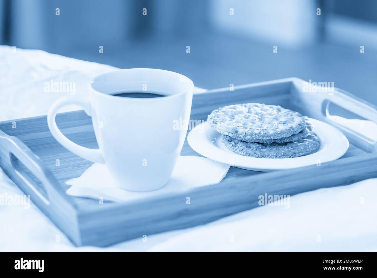 Tray with coffee and crackers breakfast on a bed Stock Photo - Alamy