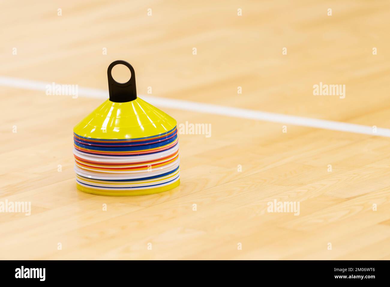 Training cones on hardwood court floor. Basketball, futsal, handball ...