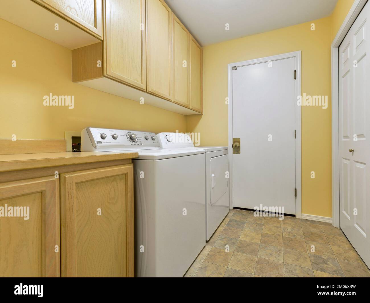 Modern residential laundry room interior Stock Photo - Alamy