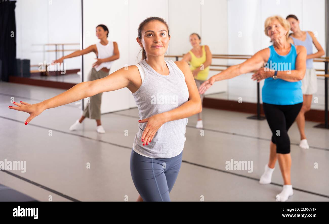 Women performing contemporary dance in training room Stock Photo - Alamy