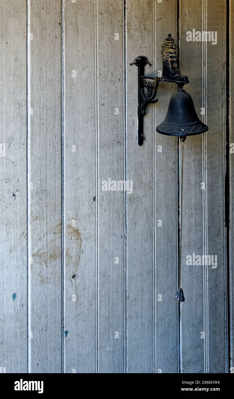 Vintage door bell on the wall of old wooden house - Castro, Chile Stock ...