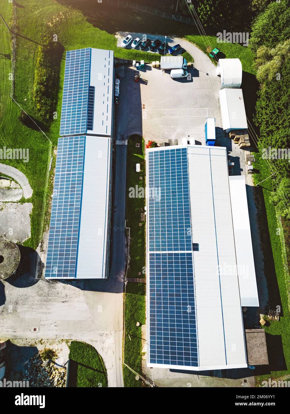 Vertical photo top down aerial view solar panels on the roof of two ...