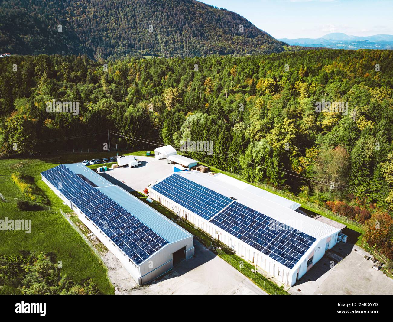 Solar panels on the roof top of a warehouse somewhere in the country ...