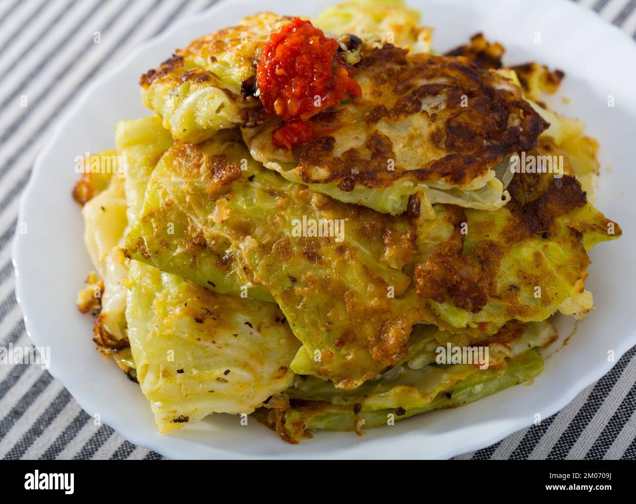 Cabbage in batter with adjika sauce Stock Photo - Alamy