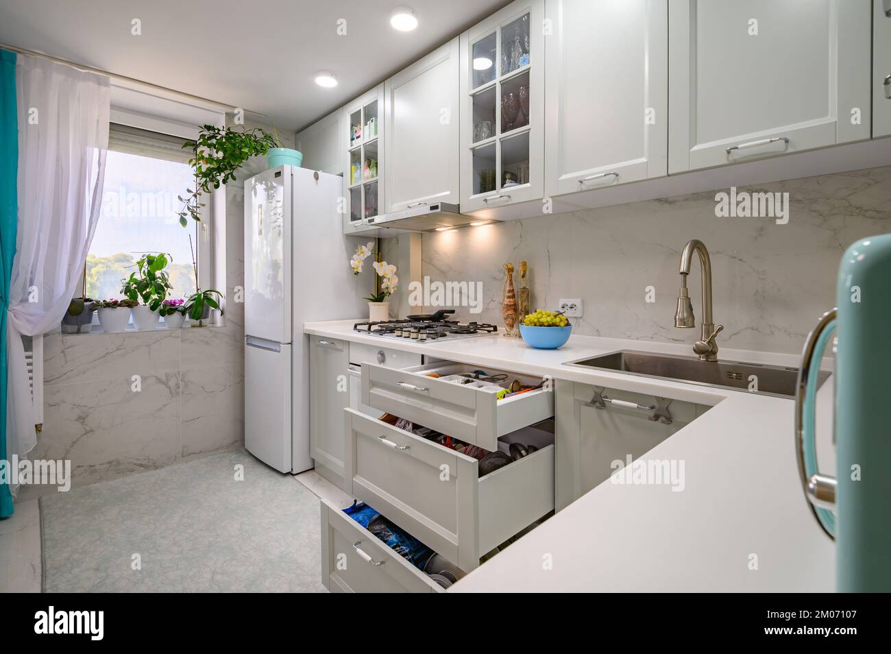 White new modern well designed kitchen interior Stock Photo - Alamy