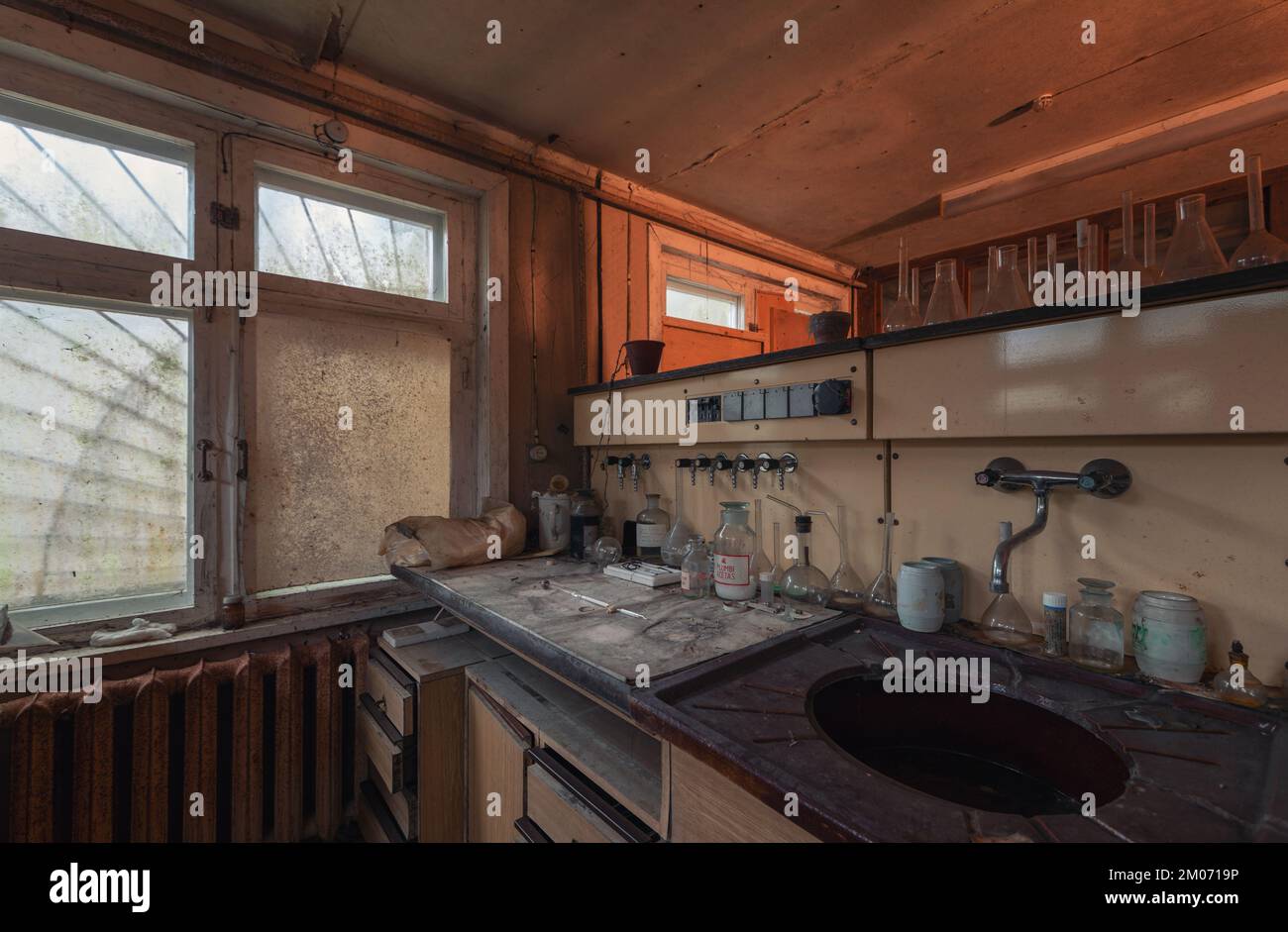 Old abandoned chemical laboratory. Long table with broken flasks Stock ...