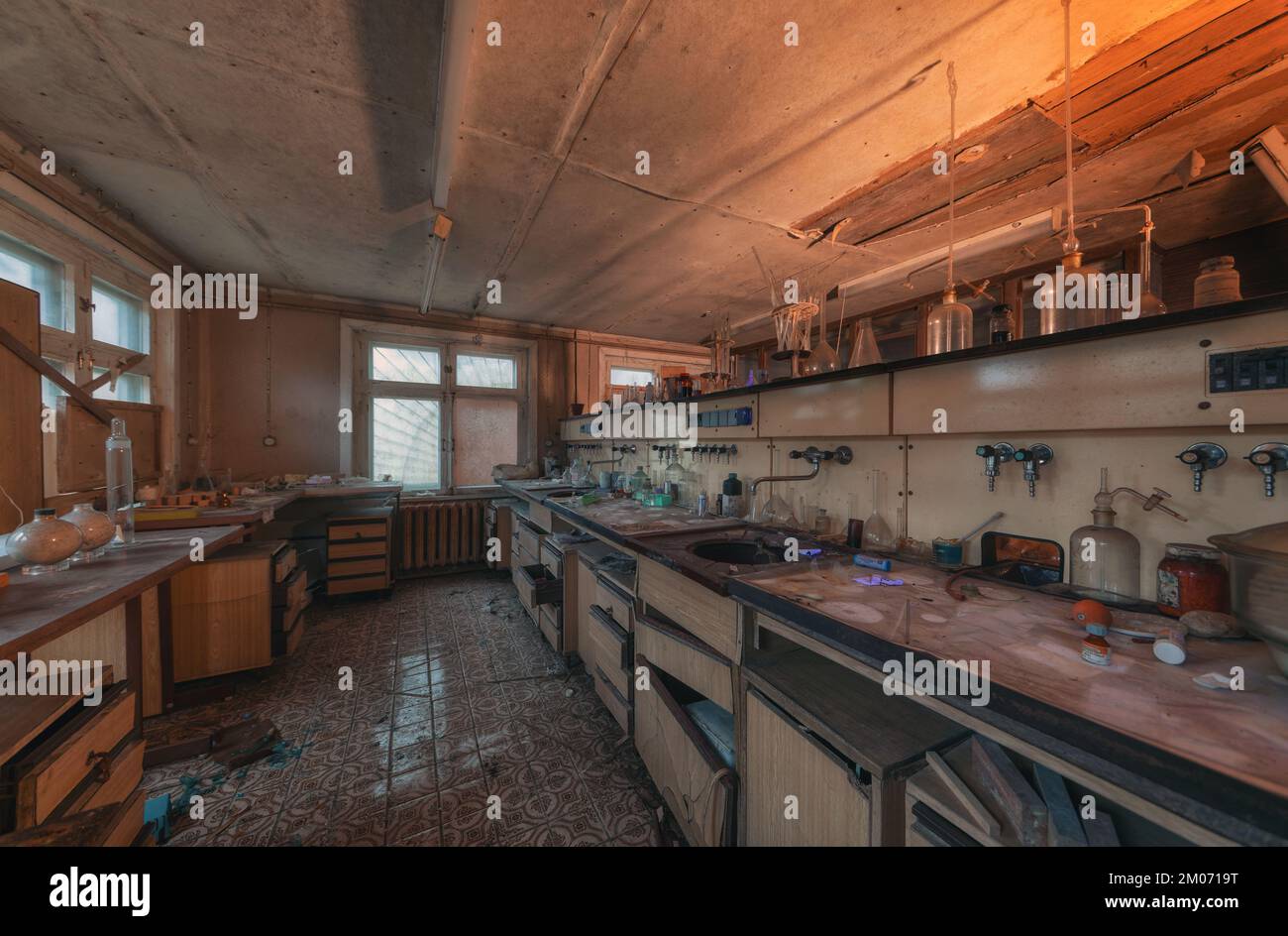 Old abandoned chemical laboratory. Long table with broken flasks Stock ...