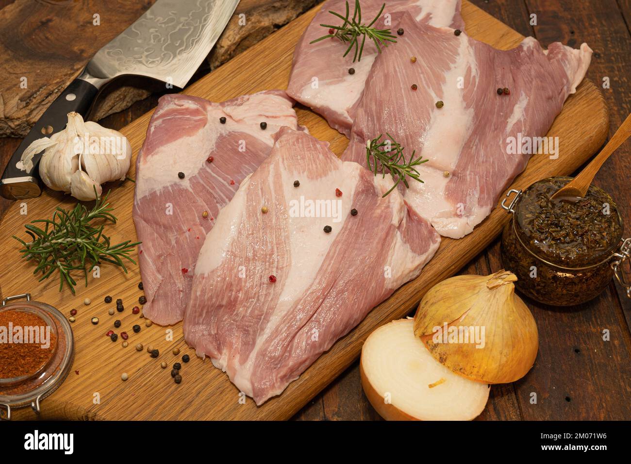 Raw Secreto iberico, iberian pig with chimichurri, onion, pepper ...