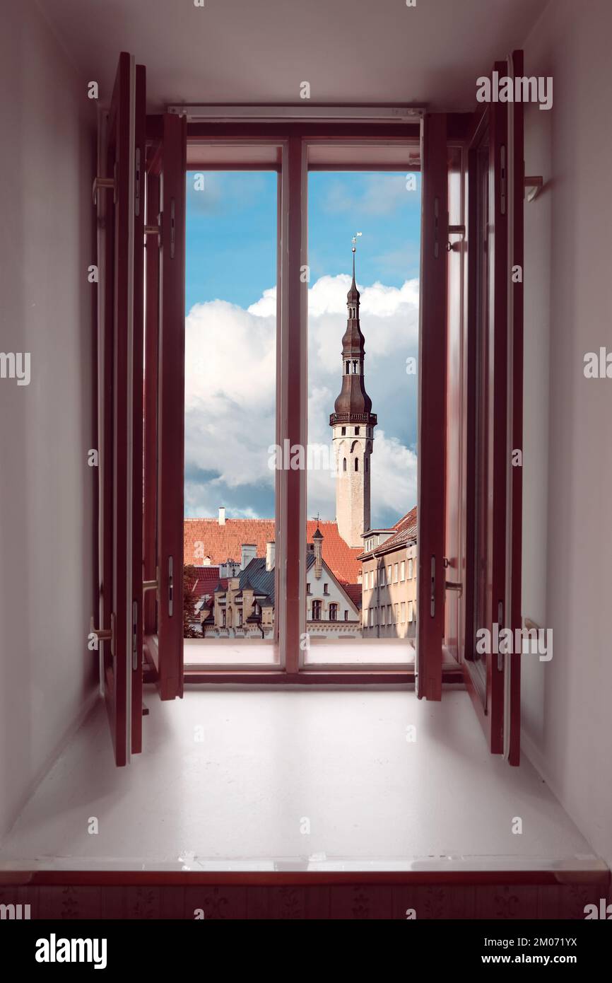 Old wooden window with view on roofs and towers in Tallin, Estonia ...