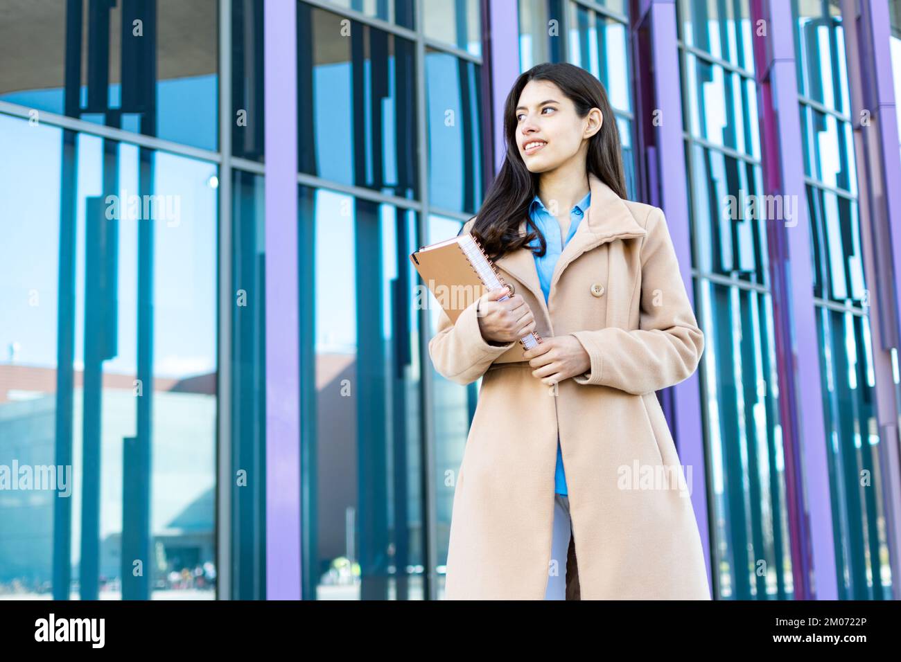 young university woman with the university in the background Stock ...