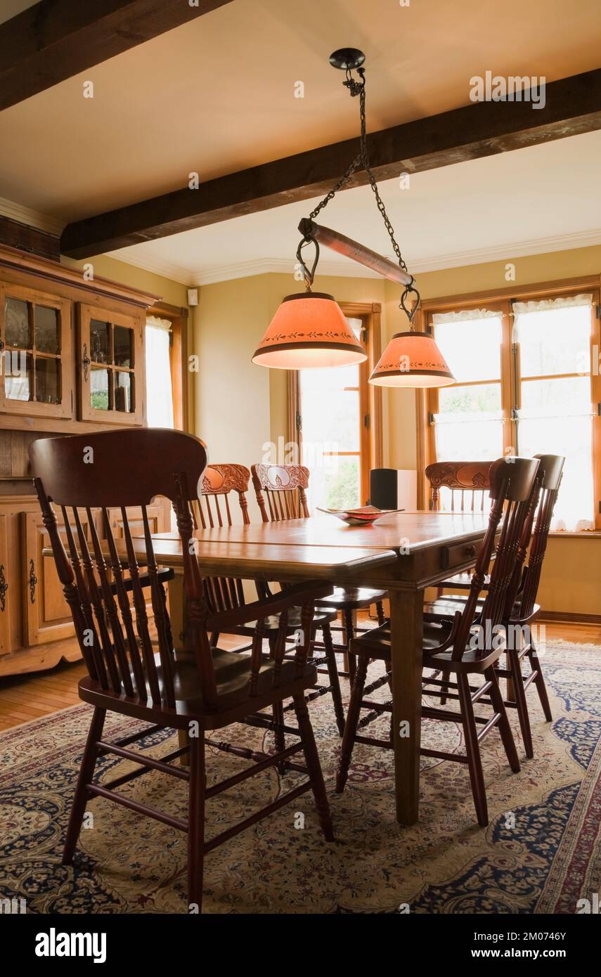 Antique table with high back chairs, buffet and furnishings in dining ...