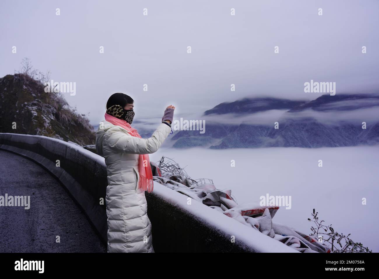GUILIN, CHINA - DECEMBER 2, 2022 - A tourist takes photos of the sea of ...