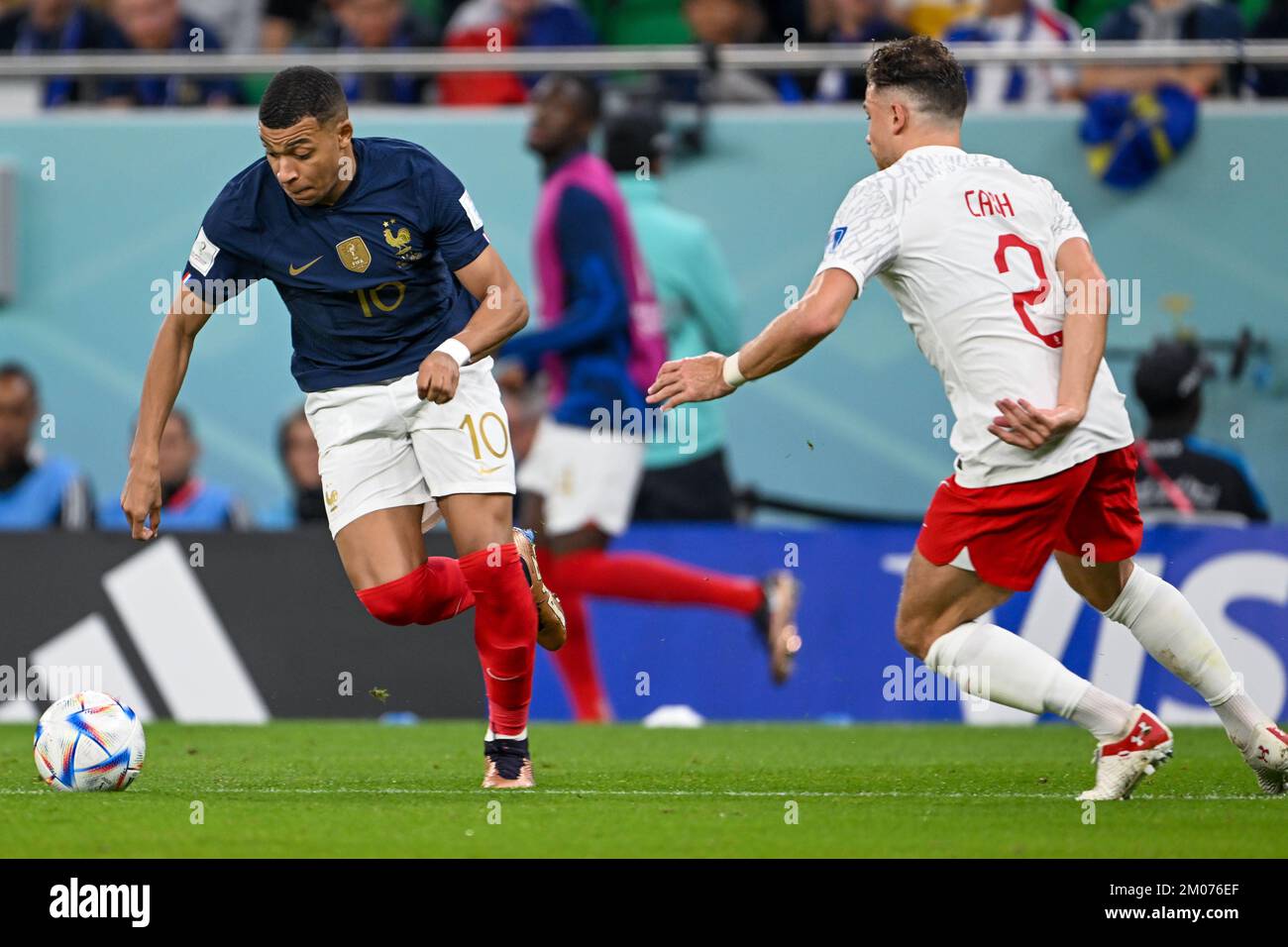 Kylian MBAPPE of France and Matty Cash of Poland during the FIFA World ...