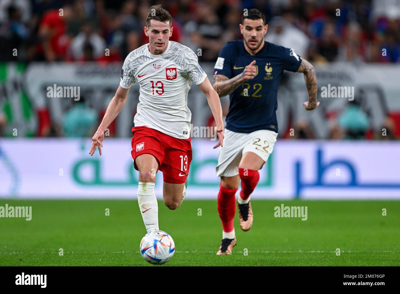 Jakub Kaminski of Poland and Theo HERNANDEZ of France during the FIFA ...