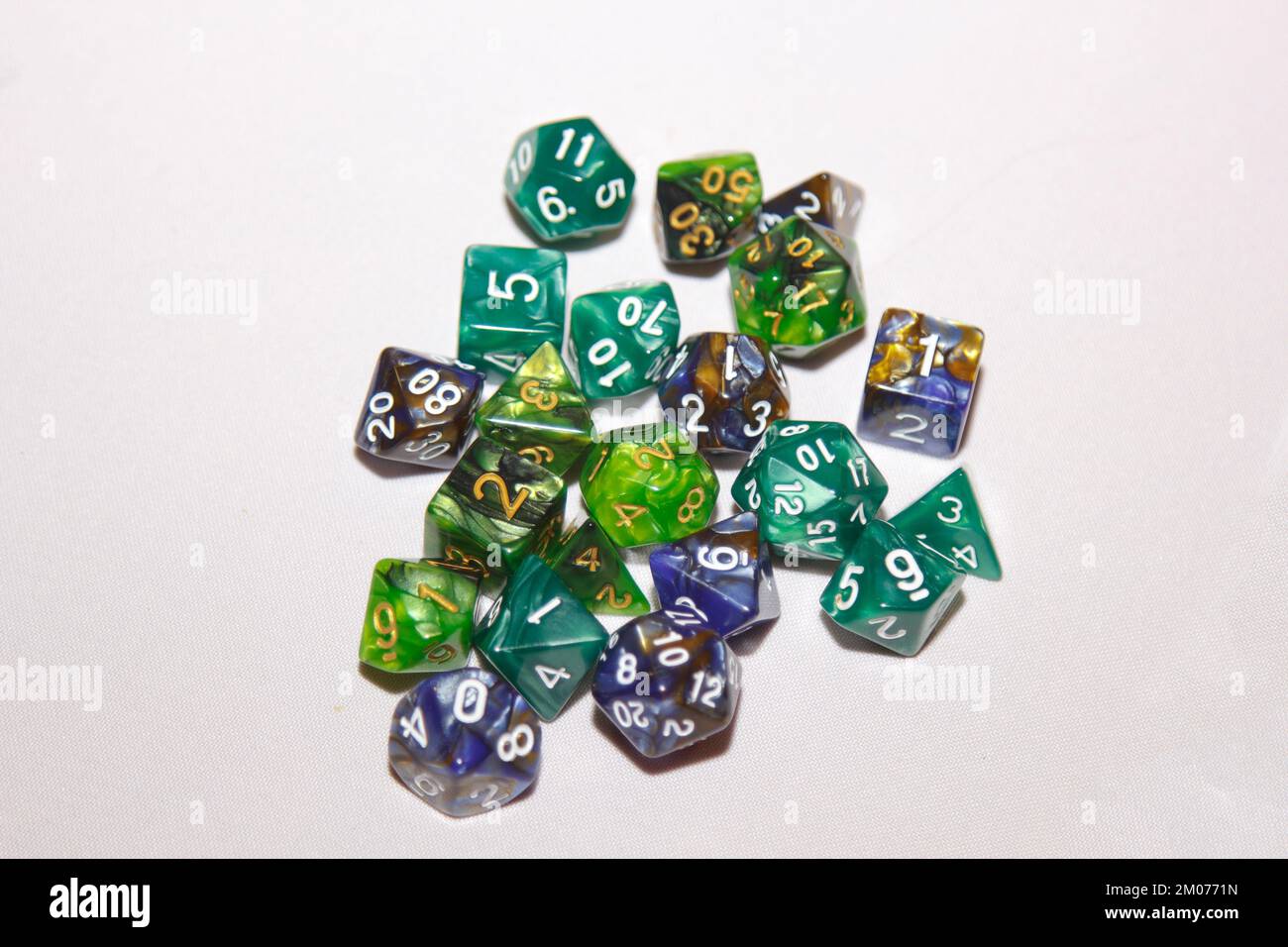 dices for board games, dnd and rpg scattered on light surface Stock ...