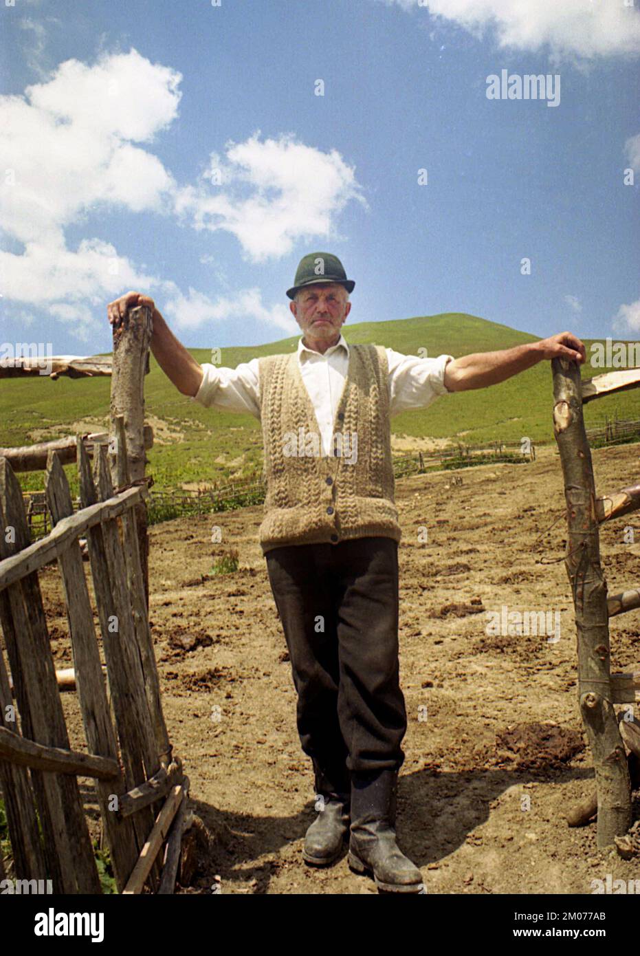 Prahova County, Romania, May 1990. Shepherd standing in the door of the ...