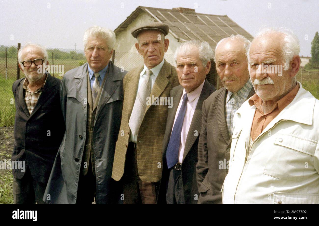Prahova County, Romania, 1990. Group of elderly men who witness the U.S ...