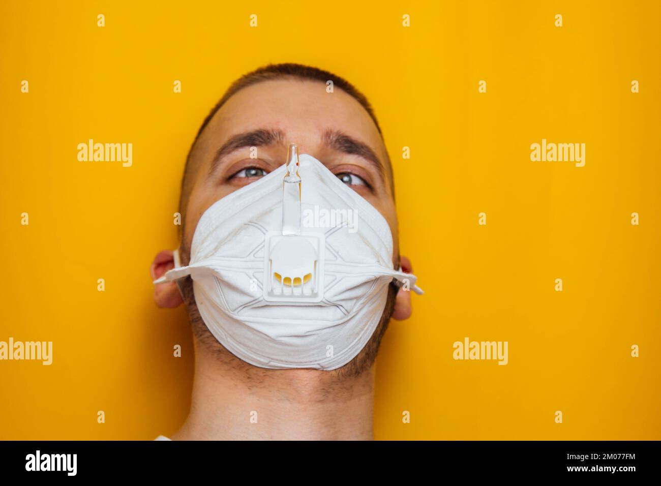 Scared man wearing protective clothing and respiratory mask. Fear and ...