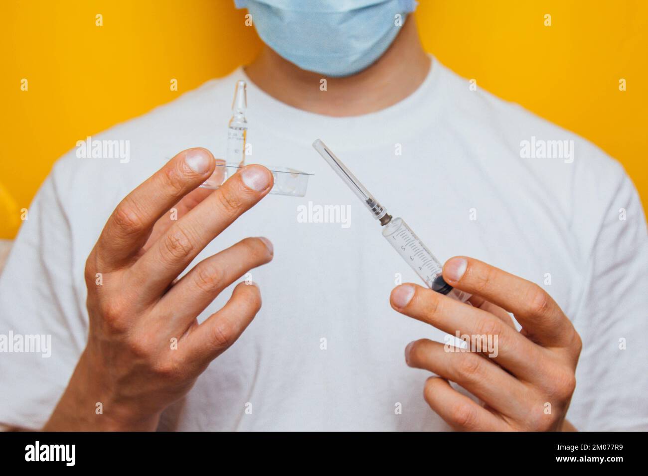 Researcher or scientist holding a flu syringe with a vaccine. Isolated ...