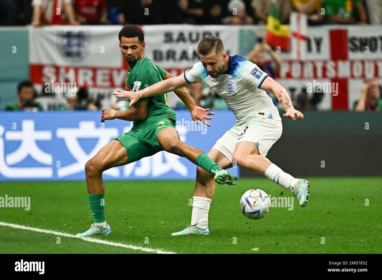 Doha, Qatar. 04th Dec, 2022. Pape Gueye of Senegal and Luke Shaw of ...