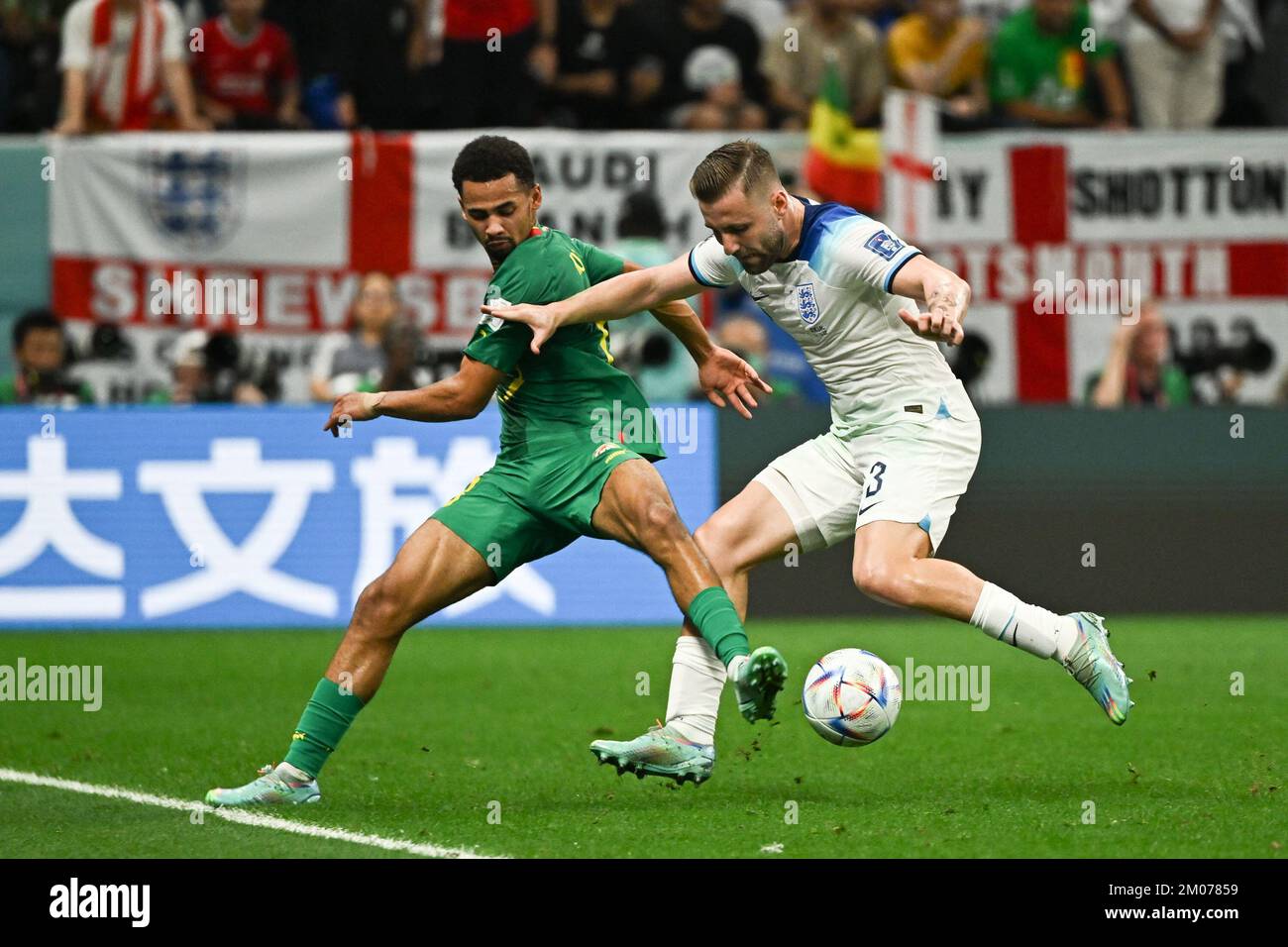 Doha, Qatar. 04th Dec, 2022. Pape Gueye of Senegal and Luke Shaw of ...