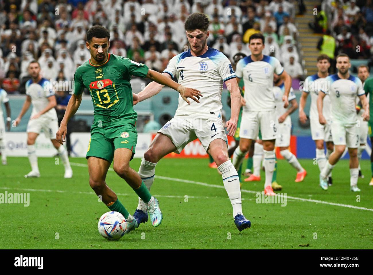 Doha, Qatar. 04th Dec, 2022. Pape Gueye of Senegal and Declan Rice of ...