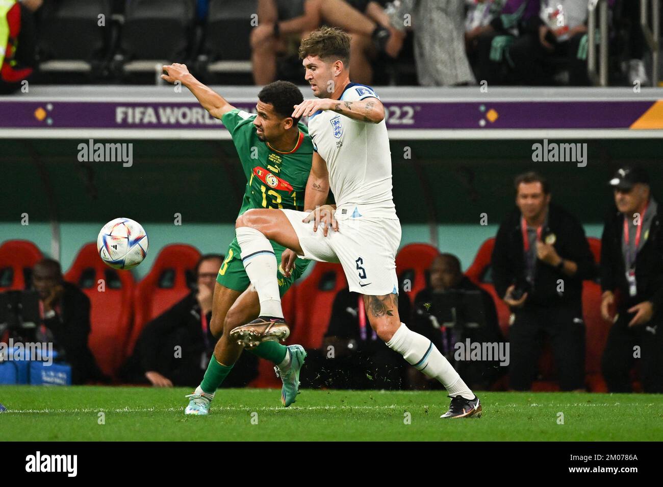 Doha, Qatar. 04th Dec, 2022. Pape Gueye of Senegal and John Stones of ...