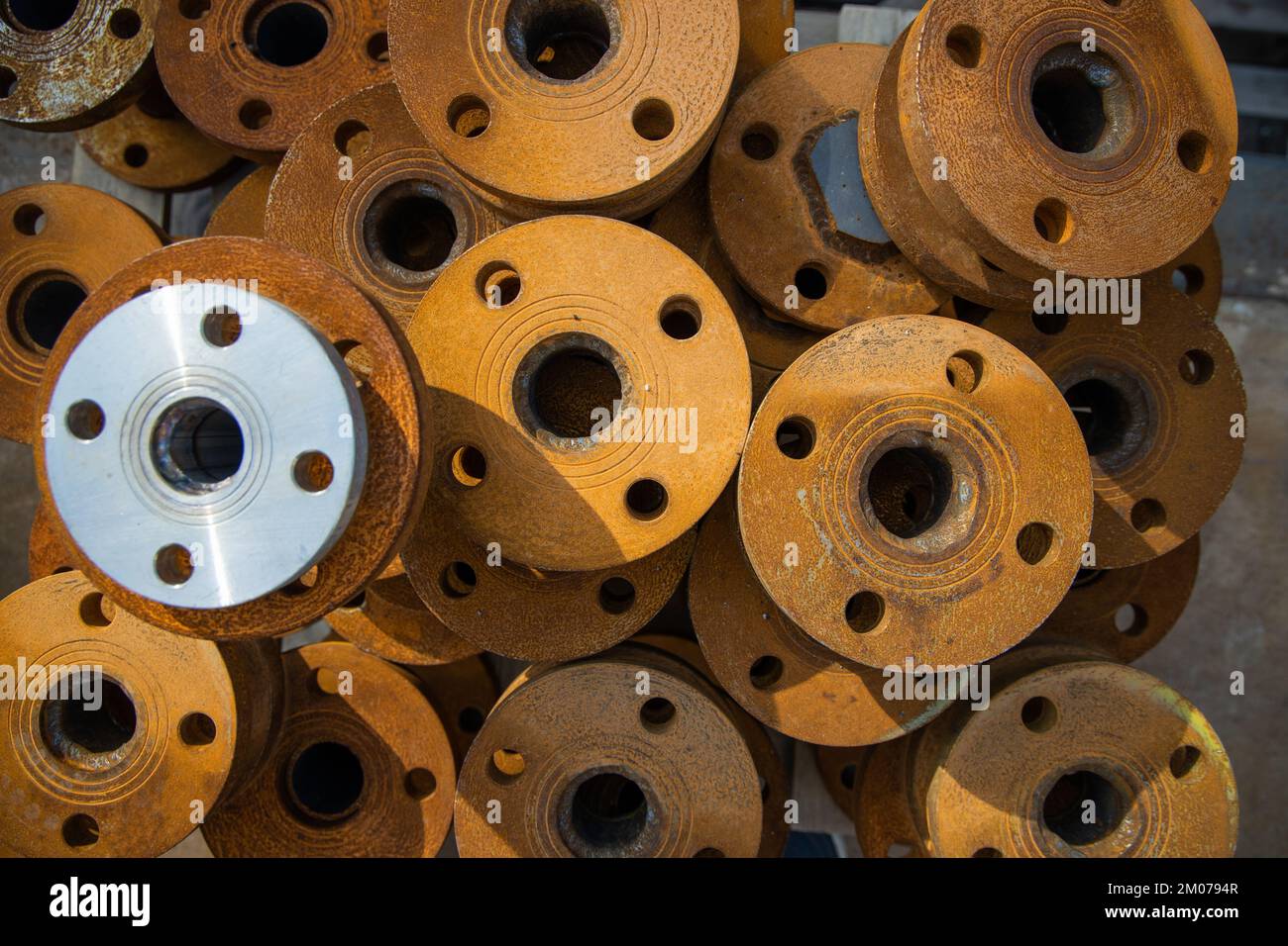 Rusty stainless steel flanges at the construction site, photo from ...