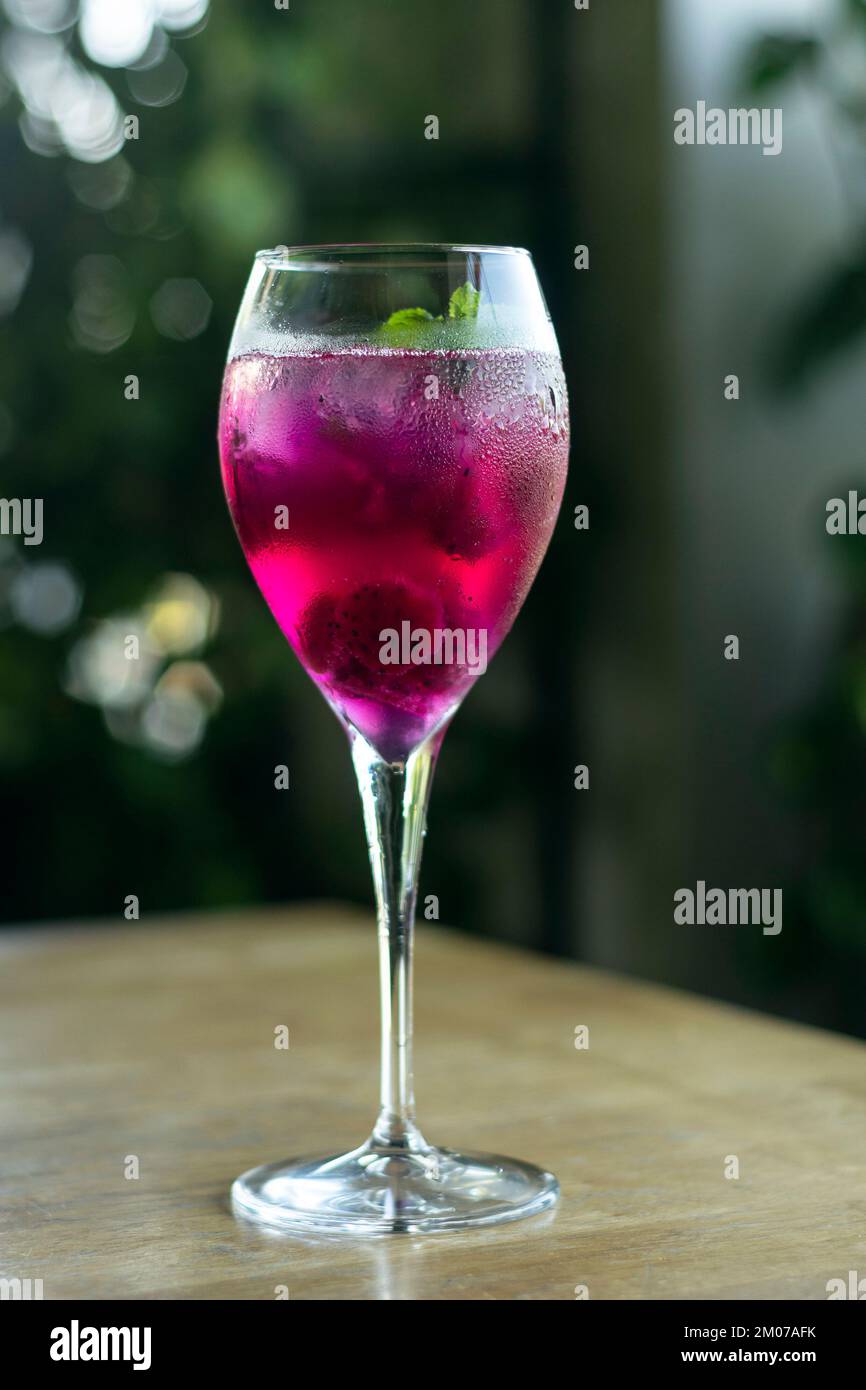 raspberry and red dragon fruit prosecco wine spritzer cocktail Stock ...